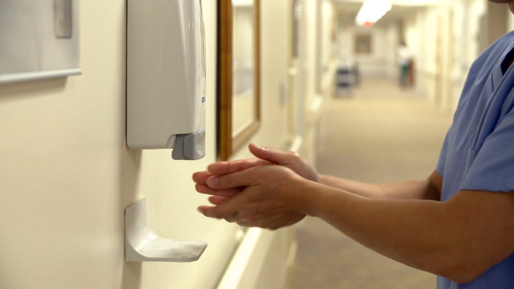 male-nurse-using-hand-sanitizer-in-hospital_4k0shiot__f0000 - Monash ...